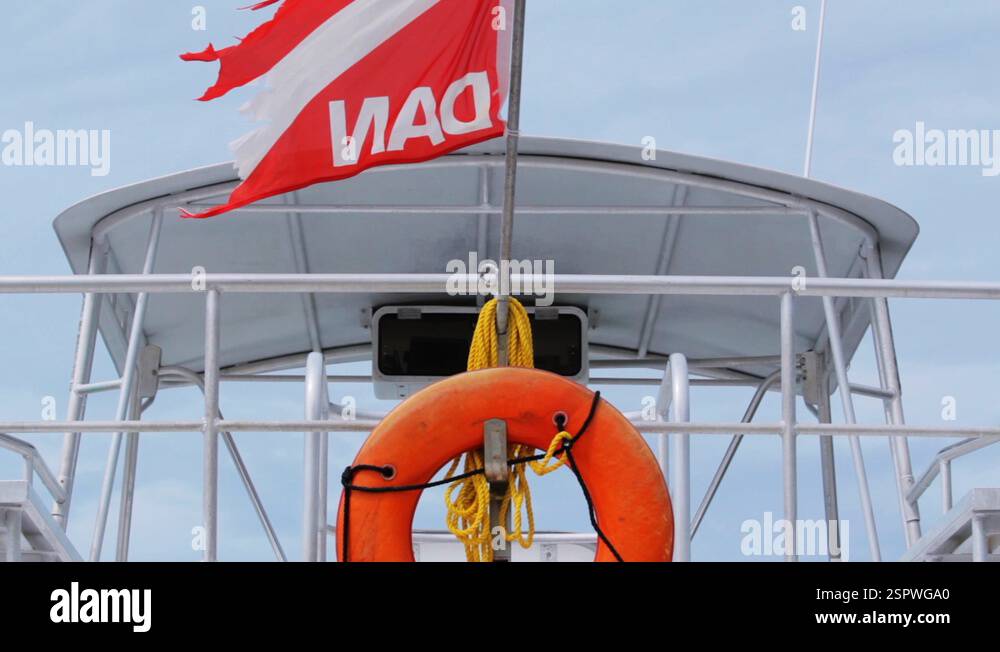 Dive boat at dock with Diver Alert Network and life ring Stock Video ...