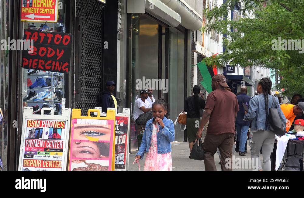 Residents of Harlem at the West 125th Street. NYC, New York, USA Stock ...