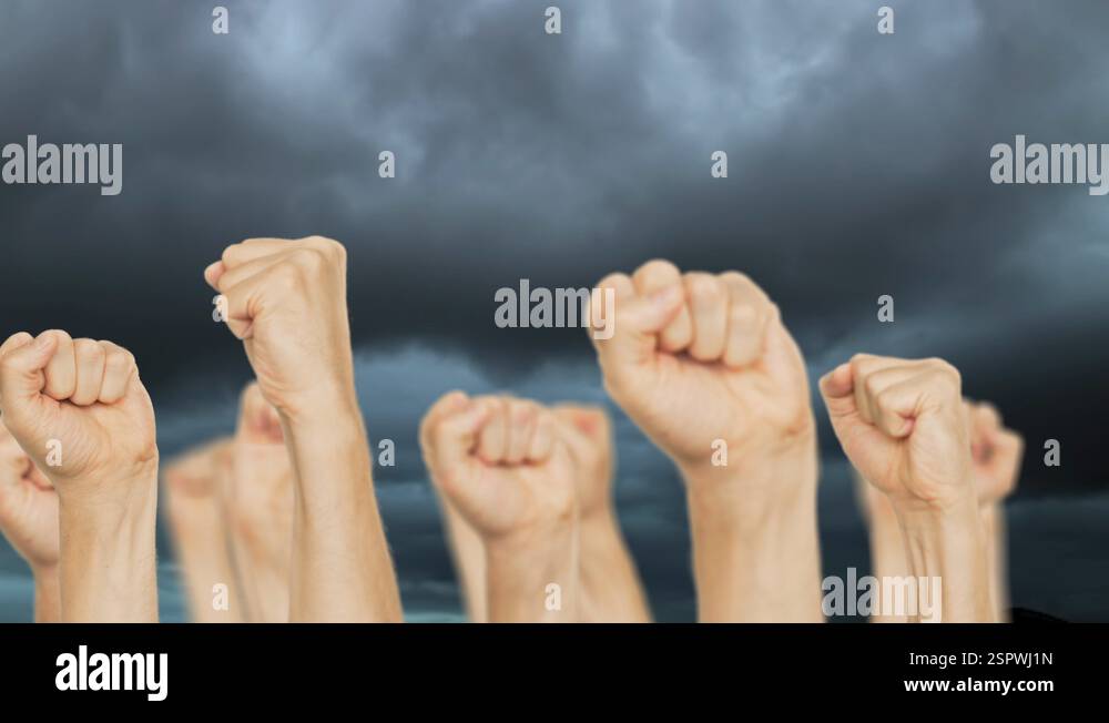 Group people raising up clenched fist walking forward on cloudysky ...