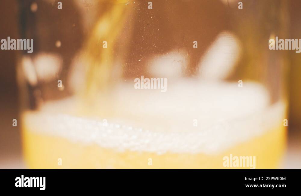 beer with foam poured into a glass beaker. close-up Stock Video Footage ...
