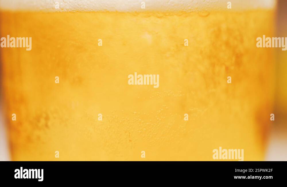 Light beer with foam poured into a glass beaker.close-up Stock Video ...