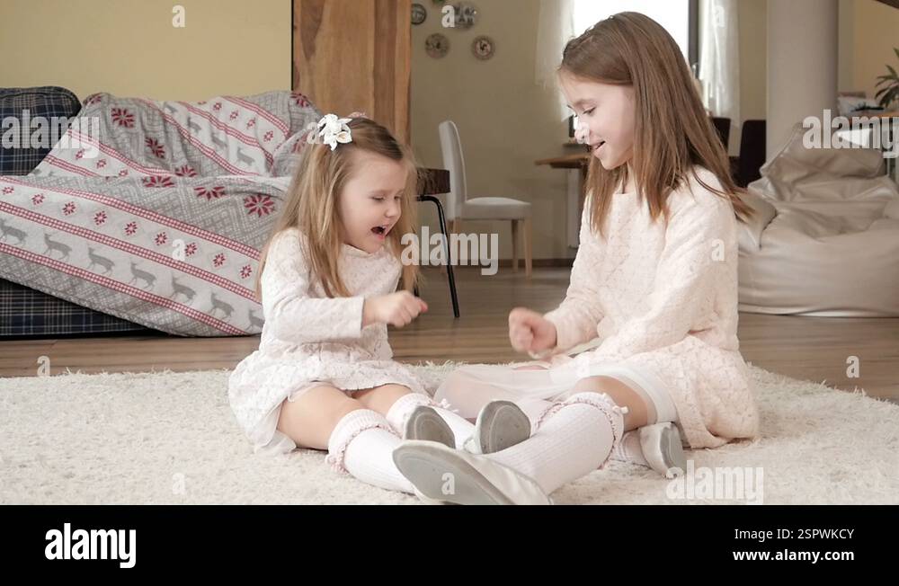 Little girls Kids play a Hand Game rock-paper-scissors at Home having ...