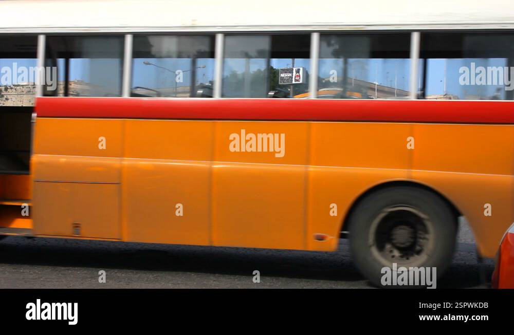 Old orange buses in the old bus terminus at Valetta Malta Stock Video ...