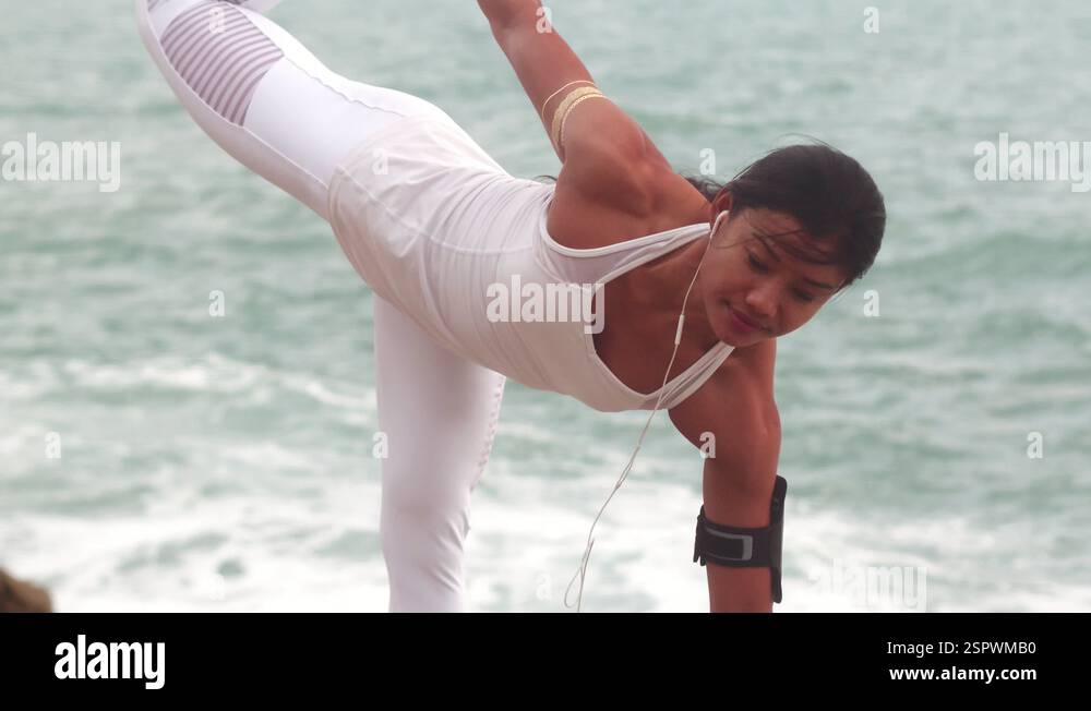 Asian woman in yoga dancer pose Nataradjasana and warrior pose ...