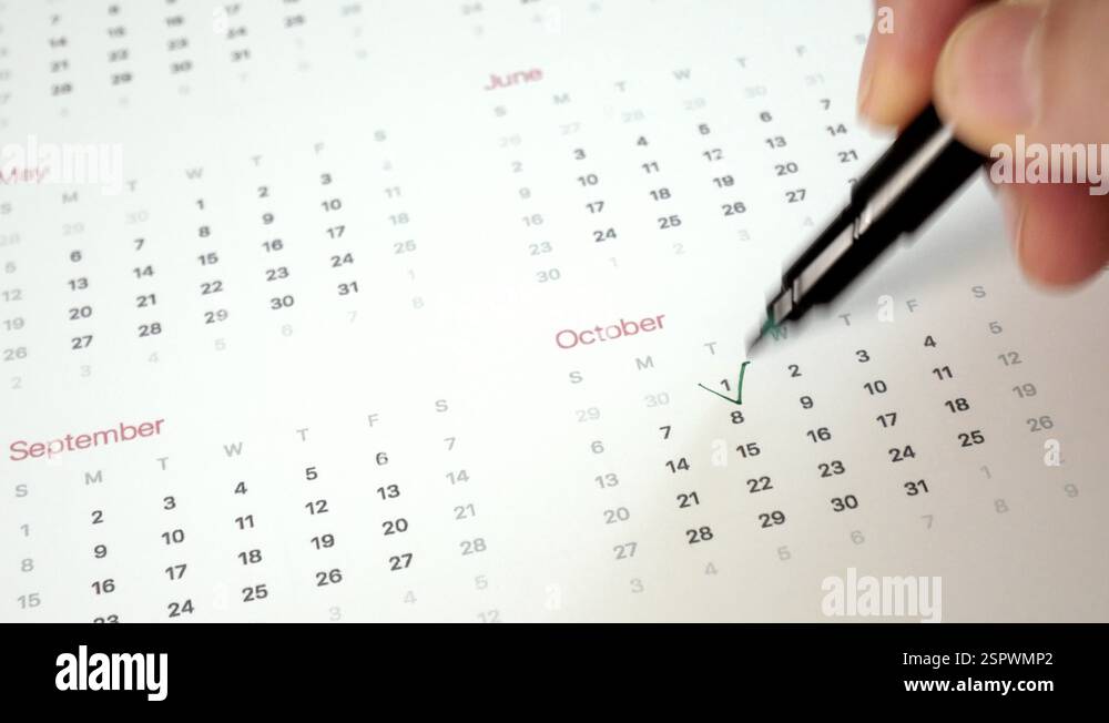 Sign the day in the calendar with a pen, draw a tick Stock Video ...