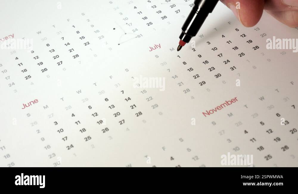 Sign the day in the calendar with a pen, draw a tick Stock Video ...