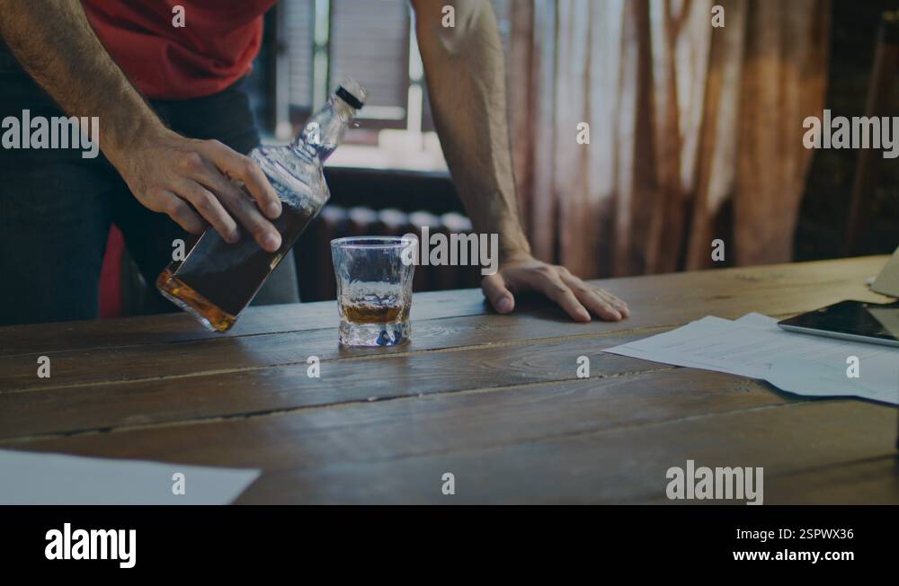 Whiskey bottle pouring in glass. Pouring alcohol drinks. Jack daniels ...