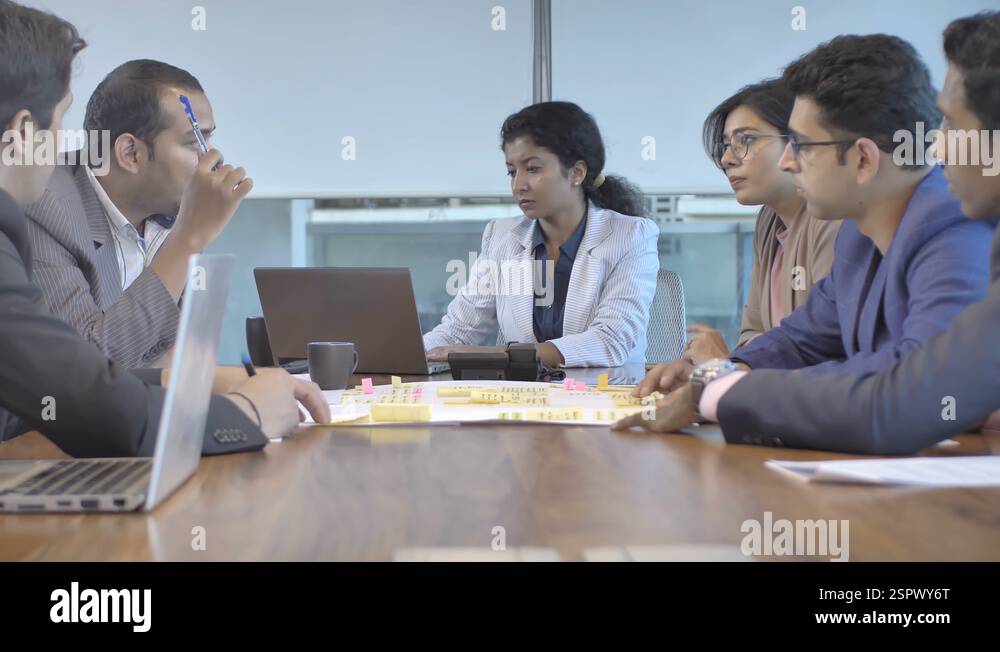 A smart and dynamic Indian team working together in modern business ...