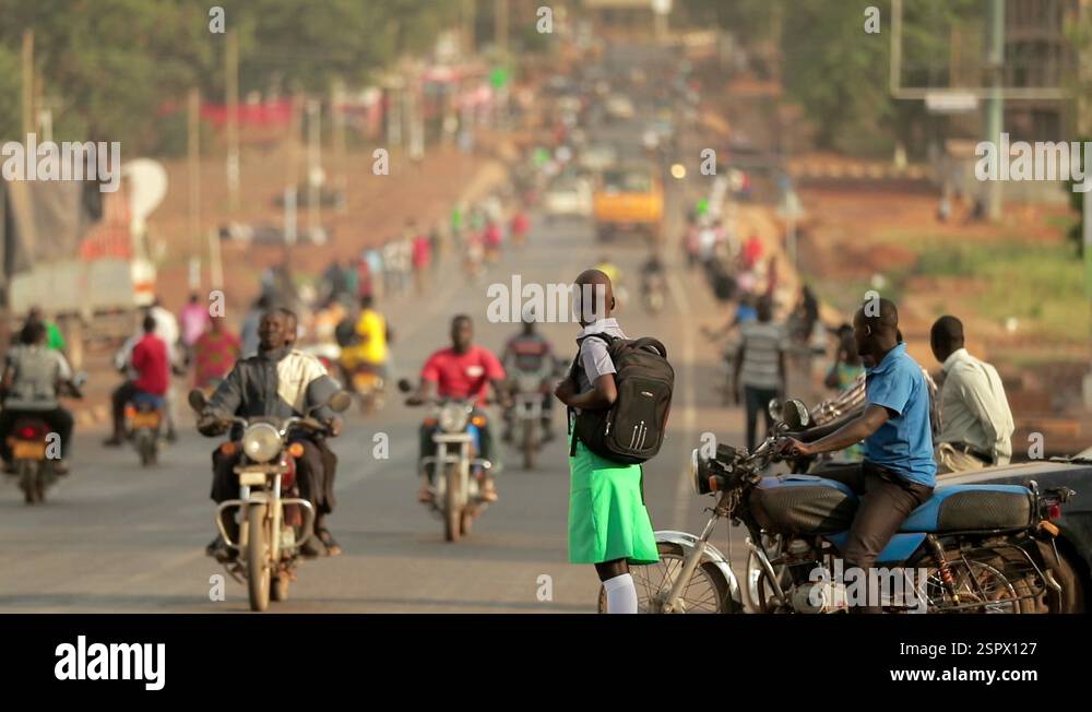 African busy Crowd of people walking and driving in main street ...