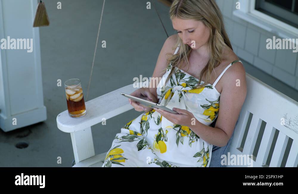 Young woman relaxing on porch with smart phone, zoom in Stock Video ...