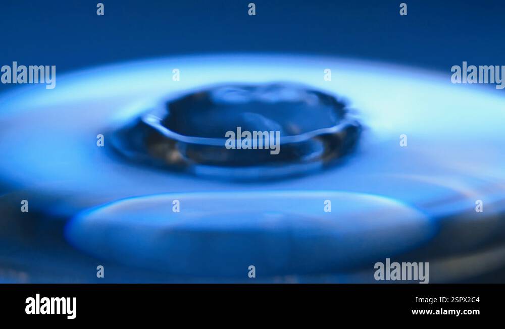Slow motion Water drop splash into calm water Stock Video Footage - Alamy