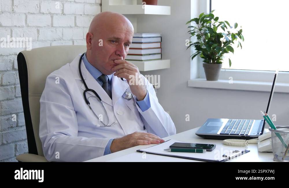 Worried Doctor Thinking Disillusioned and Nervous on His Desk Office in ...
