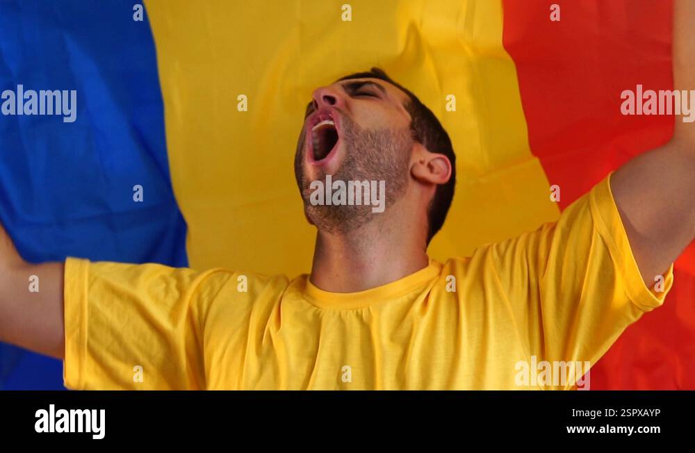 Romanian fan celebrating with flag Stock Video Footage - Alamy