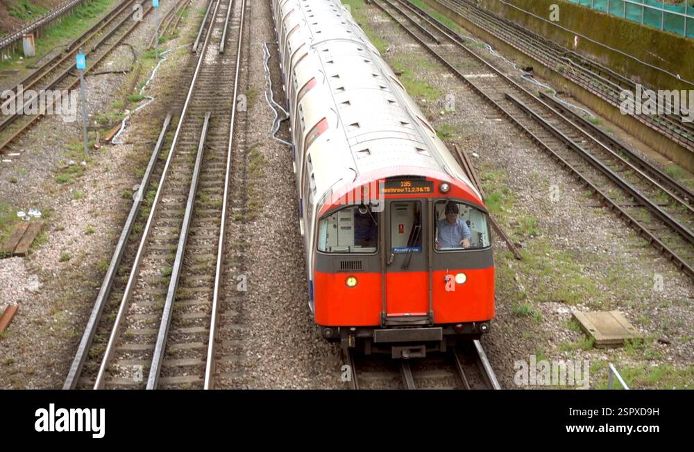 Slow Motion: London tube train above ground - overhead Stock Video ...