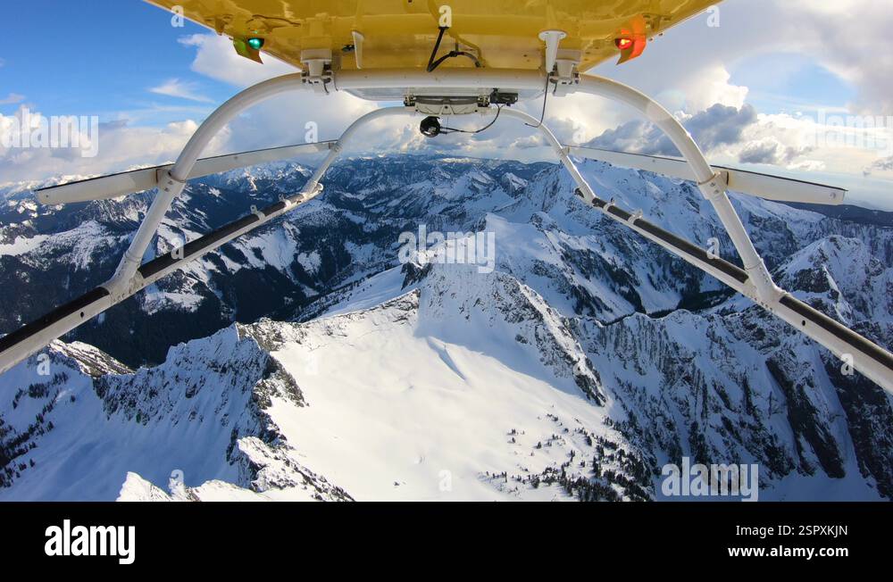Snow Mountain Summit Closeup Peak Flyover in Helicopter View From Skids ...