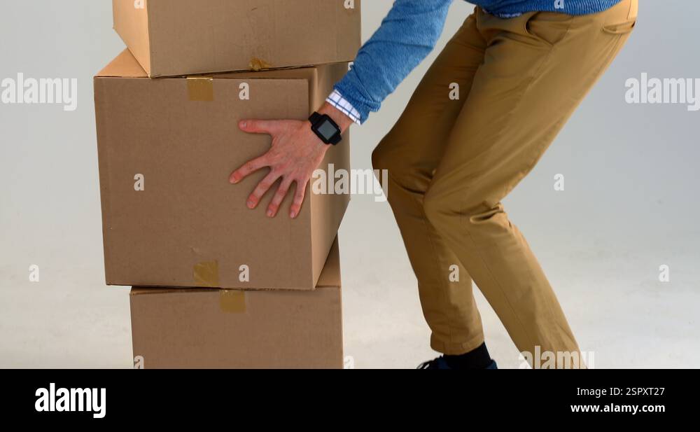 Man carrying stack of cardboard boxes against white background 4k Stock ...