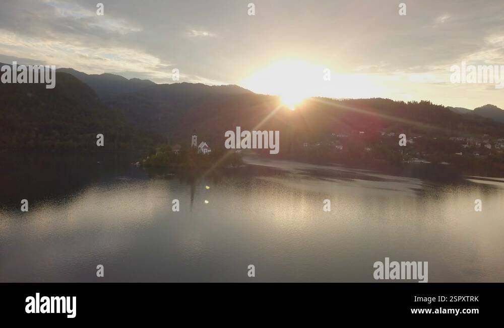 Stunning drone shot at sunset of the island of Bled on lake Bled in ...
