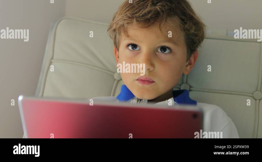 Child using tablet tech device. Young boy using new media 4K Stock ...