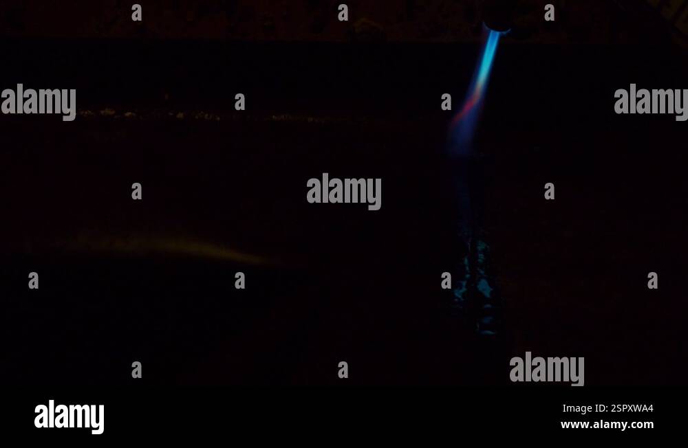 operating industrial gas burner, which burns with a blue flame. close ...