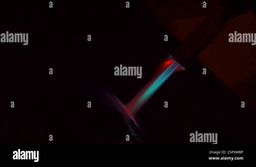 operating industrial gas burner, which burns with a blue flame. close ...