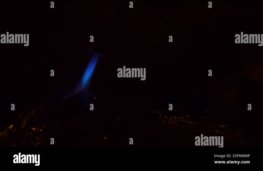 operating industrial gas burner, which burns with a blue flame. close ...