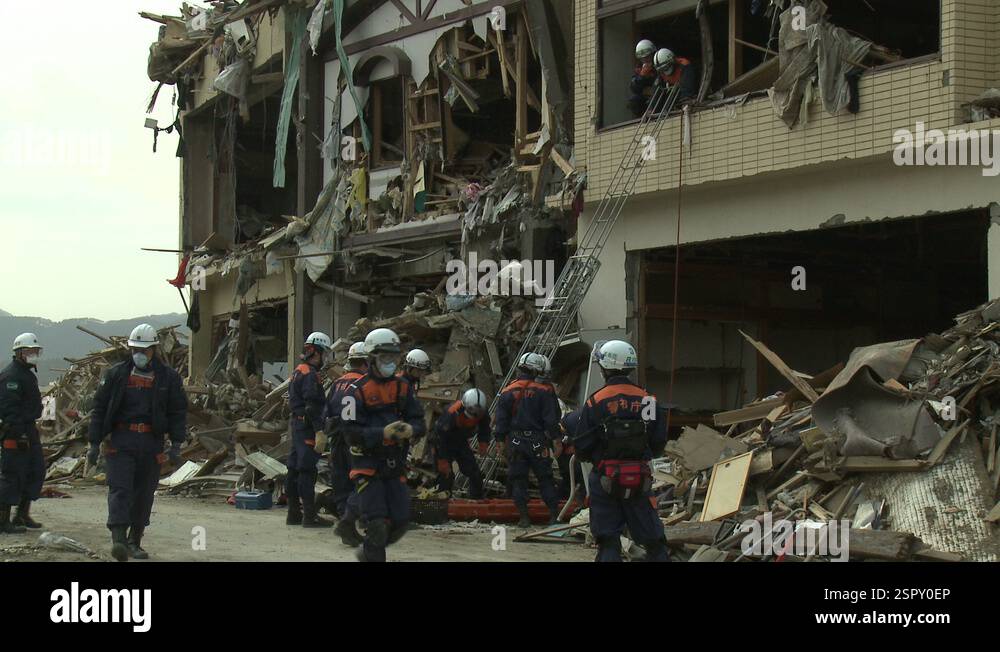 Japan Tsunami Aftermath - Rescue Team Retrieve Body From Destroyed ...