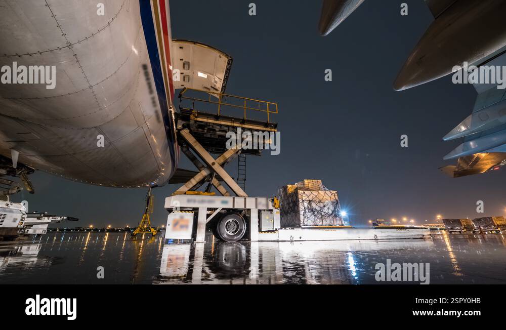 Time lapse loading cargo plane outside air freight logistic with rain ...