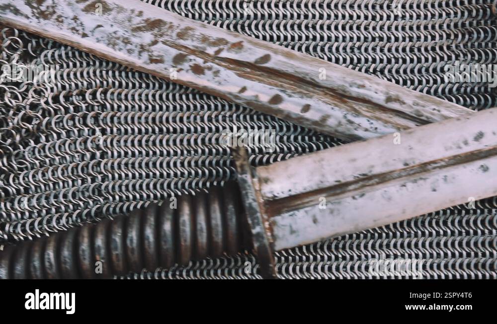 Crossed swords on chain armor, close up, historical ancient weapon ...