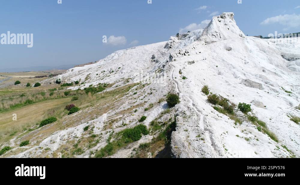 Aerial. Pamukkale terraces. Brilliantly white calcium cliff. Turkey, 4K ...