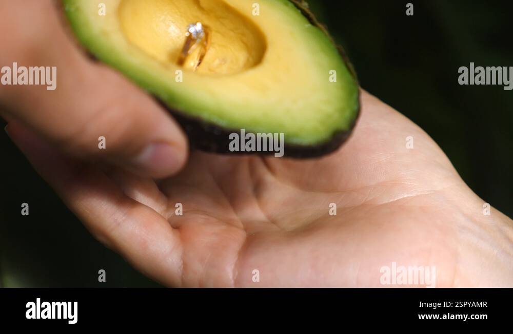 Vegan Wedding Proposal Concept. Hands Of Couple With Avocado Engagement ...