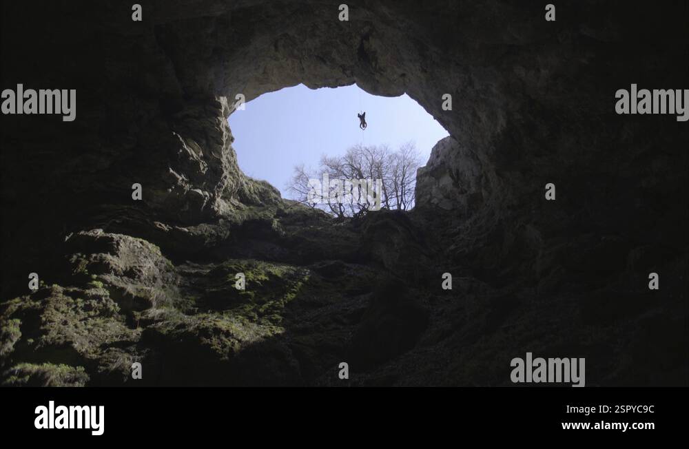big cave hole Stock Video Footage - Alamy