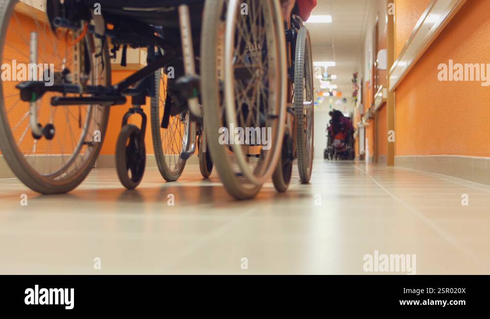 disabled man safely drives wheelchair in corridor institution slow ...