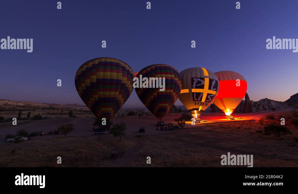 Night to day timelapse of inflating and preparing hot air balloons ...