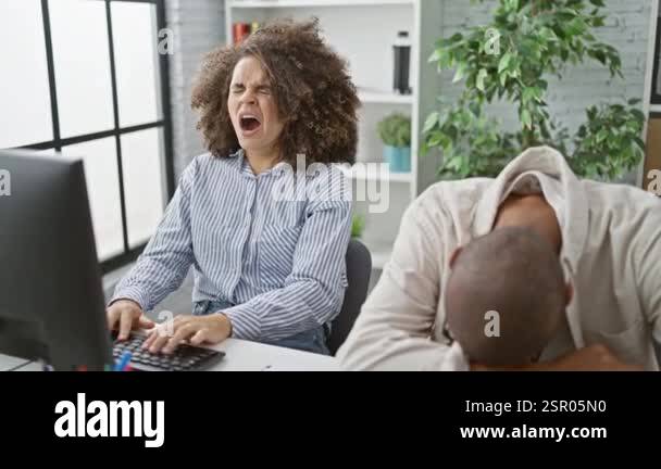 Tired man and woman, two hardworking workers, struggling with the grind ...