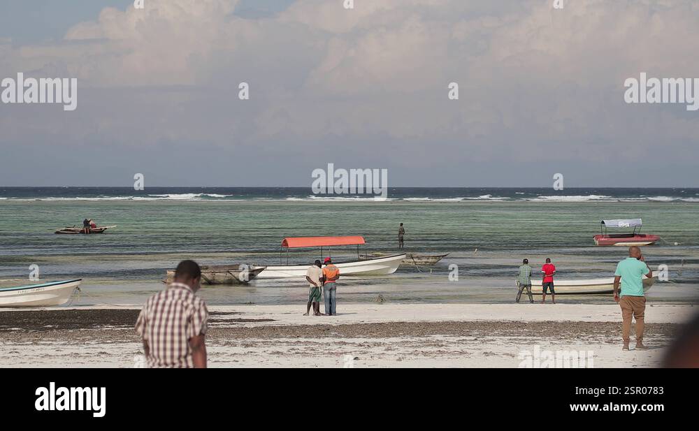 A Poor Fisherman Sails On an Outrigger Sailing Boat Coast Of Zanzibar ...