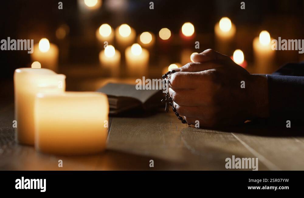 Man praying the Holy Rosary in the Church Stock Video Footage - Alamy