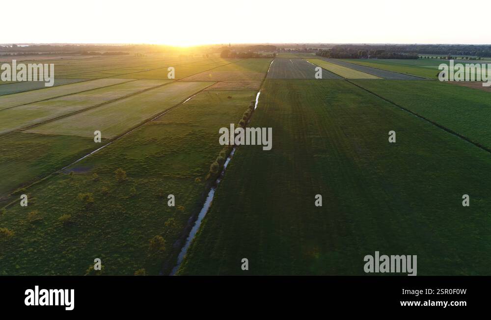 Aerial flight above countryside area during sundown early evening 4k ...