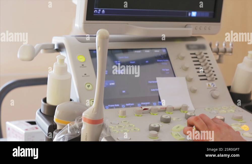 Medical ultrasound machine control panel and screen with baby on it ...