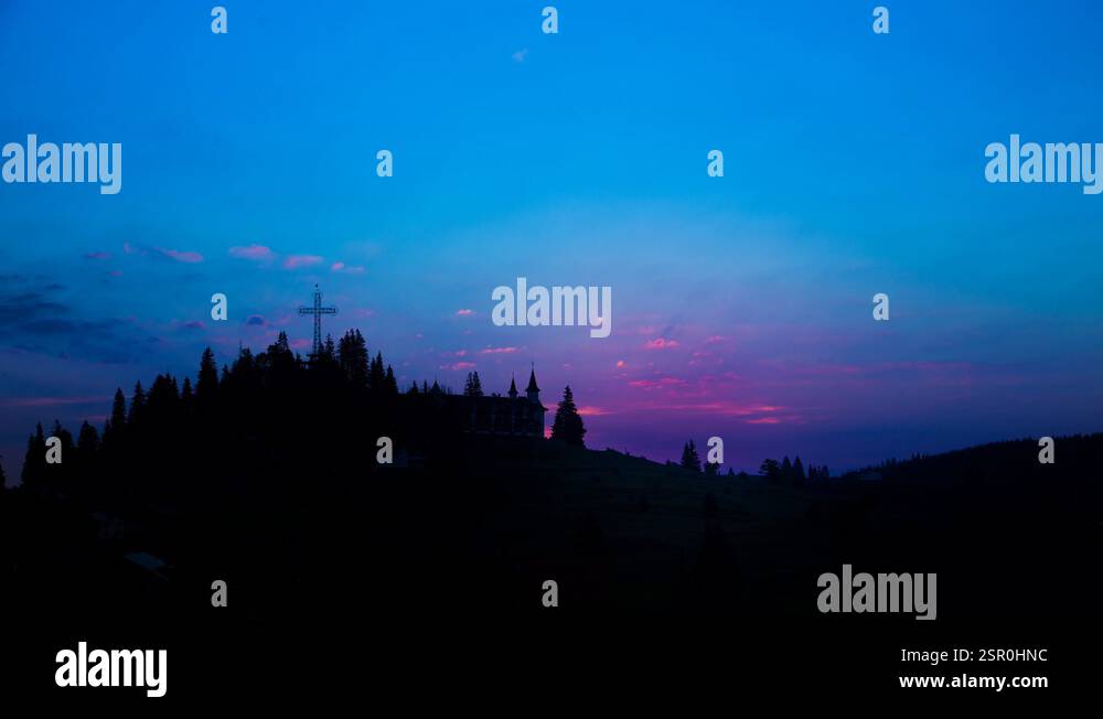 Purple sunrise timelapse shot above the pine forest. Cross on the hilltop Stock Video Footage ...