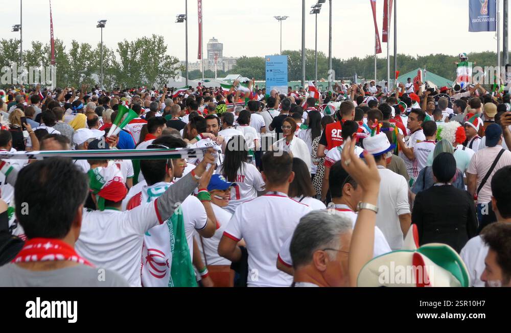 Happy Iranian crowd of fans in street waving flag chanting for iran ...
