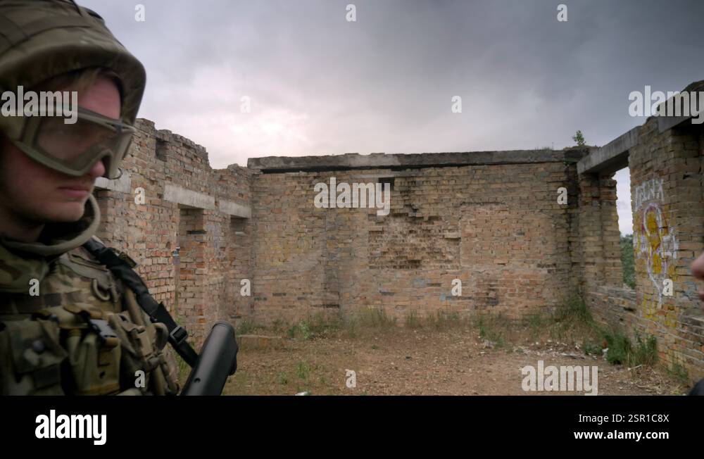 Young caucasian soldier and muslim woman in hijab standing inside brick ...