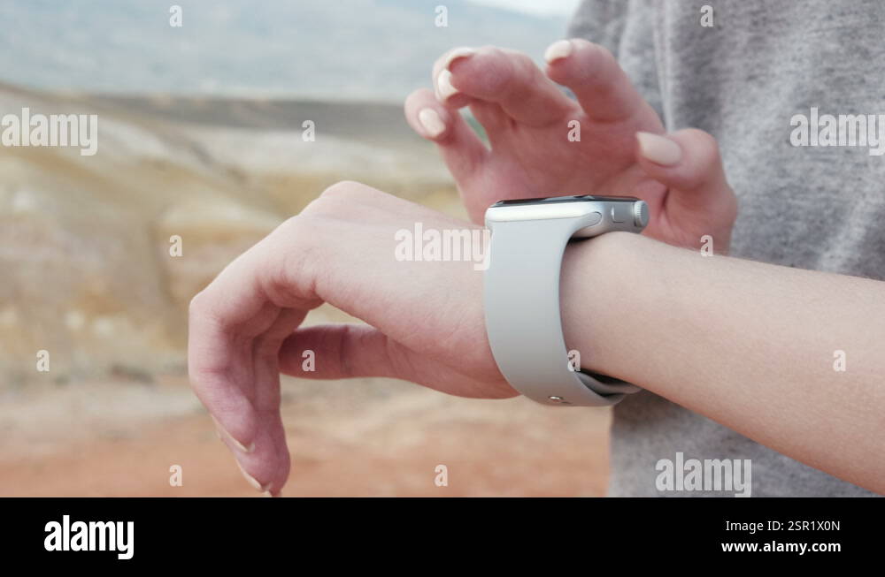 Woman making gestures on a wearable smartwatch computer device, smart ...