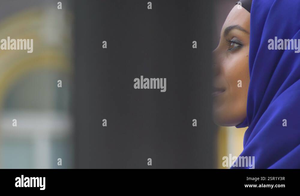 Profile of young charming muslim woman in hijab with pierced nose ...