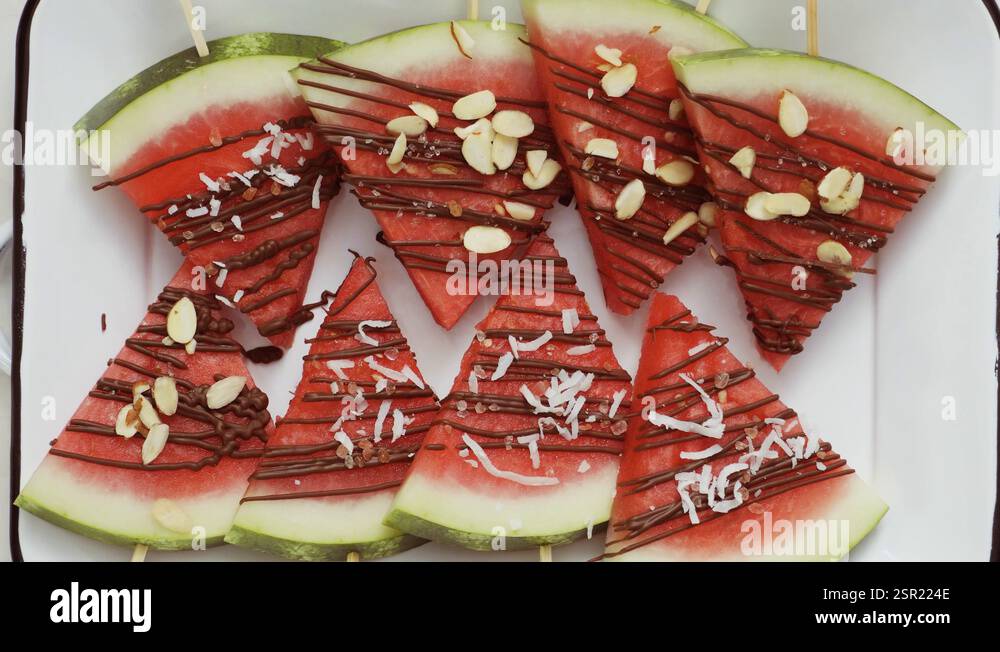 Watermelon drizzled with chocolate and topped with flaked sea salt and ...