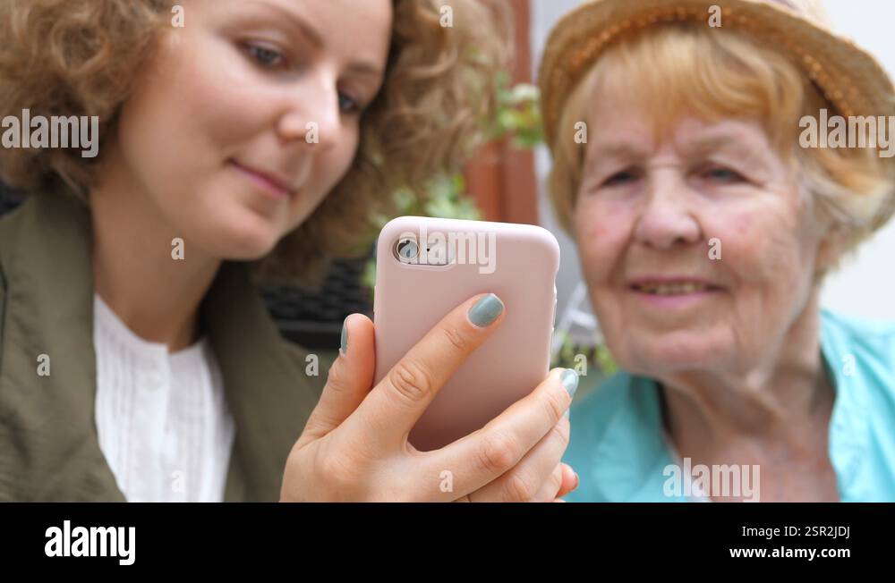Granddaughter teaching grandma smartphone Stock Videos & Footage - HD ...
