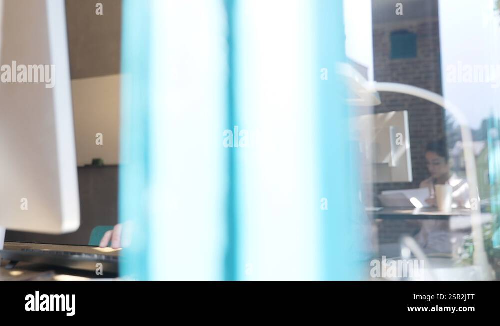 Start up of Young IT- employee. Handsome Office Worker Typing on his ...