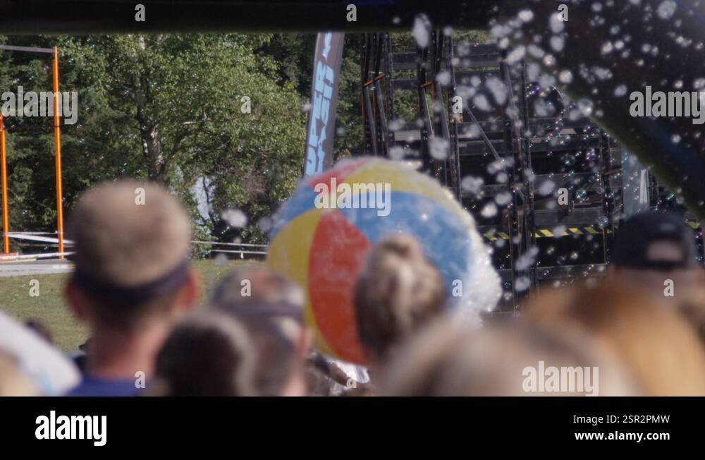 Foam party beach balls in crowd Stock Video Footage - Alamy