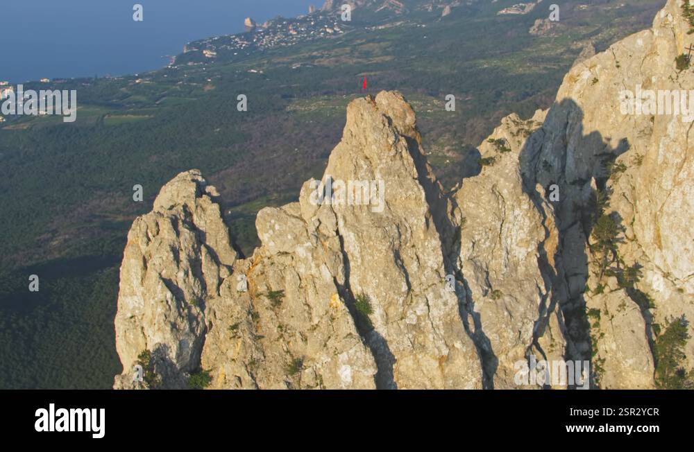 Amazing Aerial View. Flight over the rock peak of the mountain Ai-Petri ...