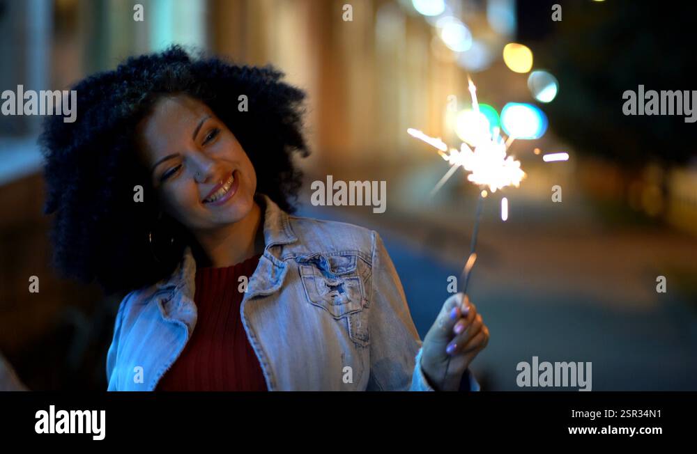 Young beautiful woman with very curly afro hair dancing with bengal ...