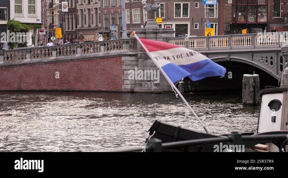 The Duch Flag on a Tourist Boat Sail Through The Canals of Amsterdam ...